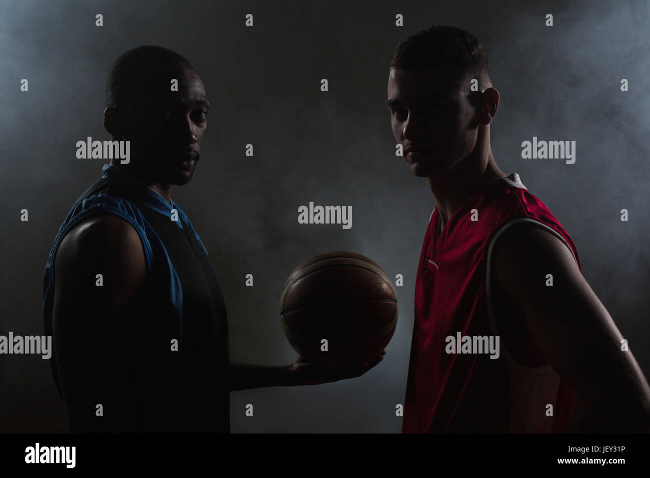 Two basketball player looking at the camera Stock Photo - Alamy