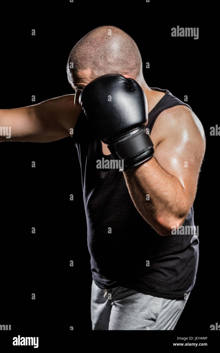 Side view of boxer hitting straight Stock Photo - Alamy
