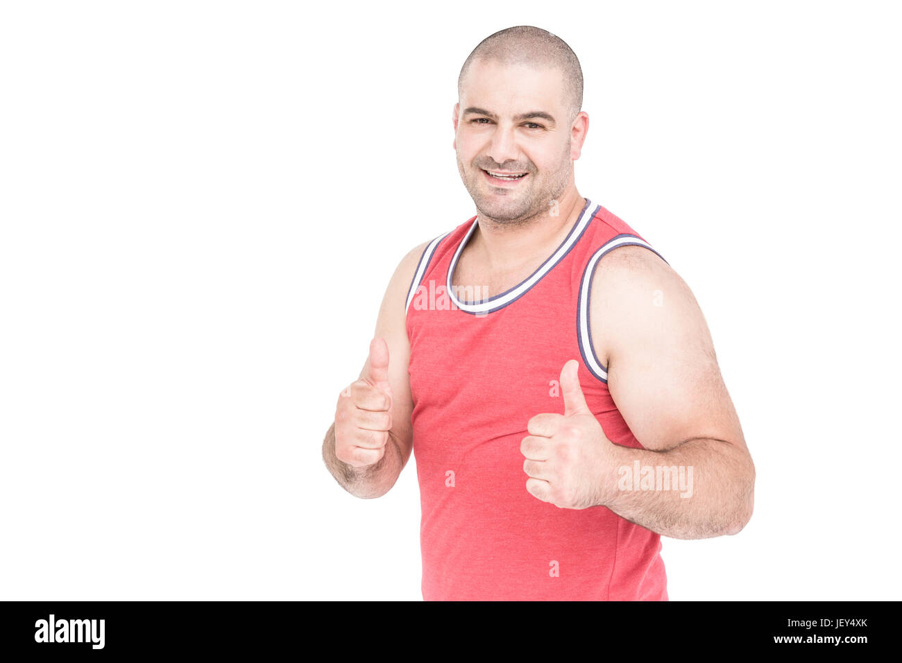Athlete posing and giving a thumbs up Stock Photo - Alamy