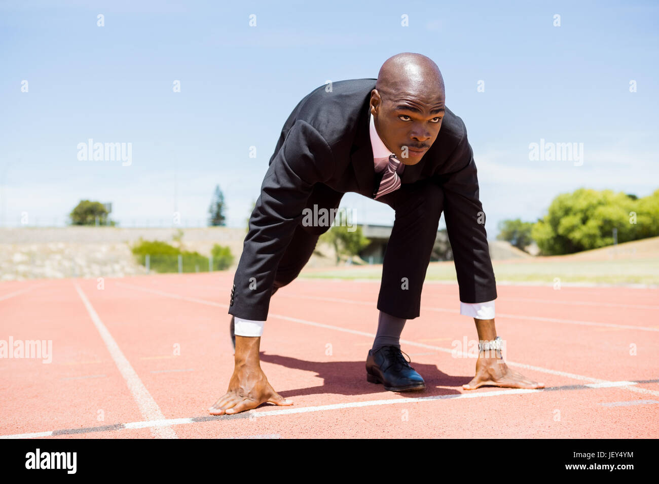 Businessman ready to run Stock Photo - Alamy Businessman ready to run Stock Photo - Alamy