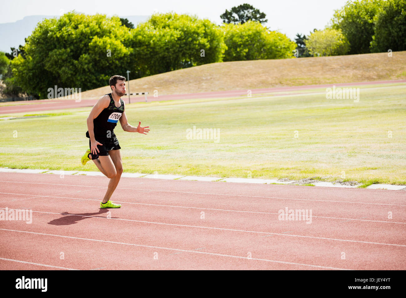 Athlete running on the racing track Stock Photo - Alamy