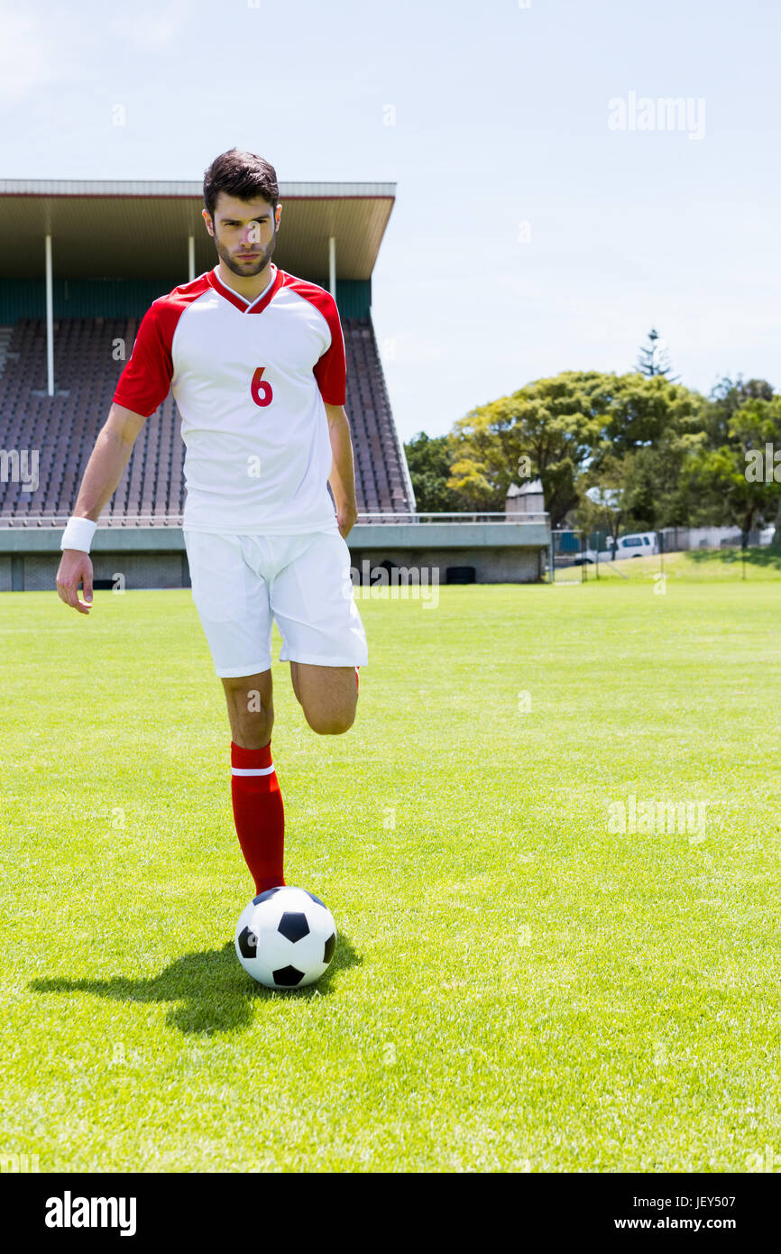 Football player warming up in stadium Stock Photo - Alamy