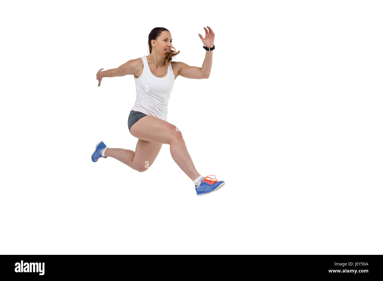 Athletic woman running on white background Stock Photo - Alamy