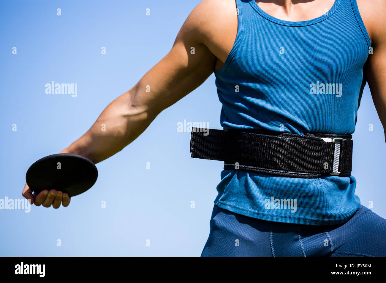 Athlete holding a discus Stock Photo - Alamy