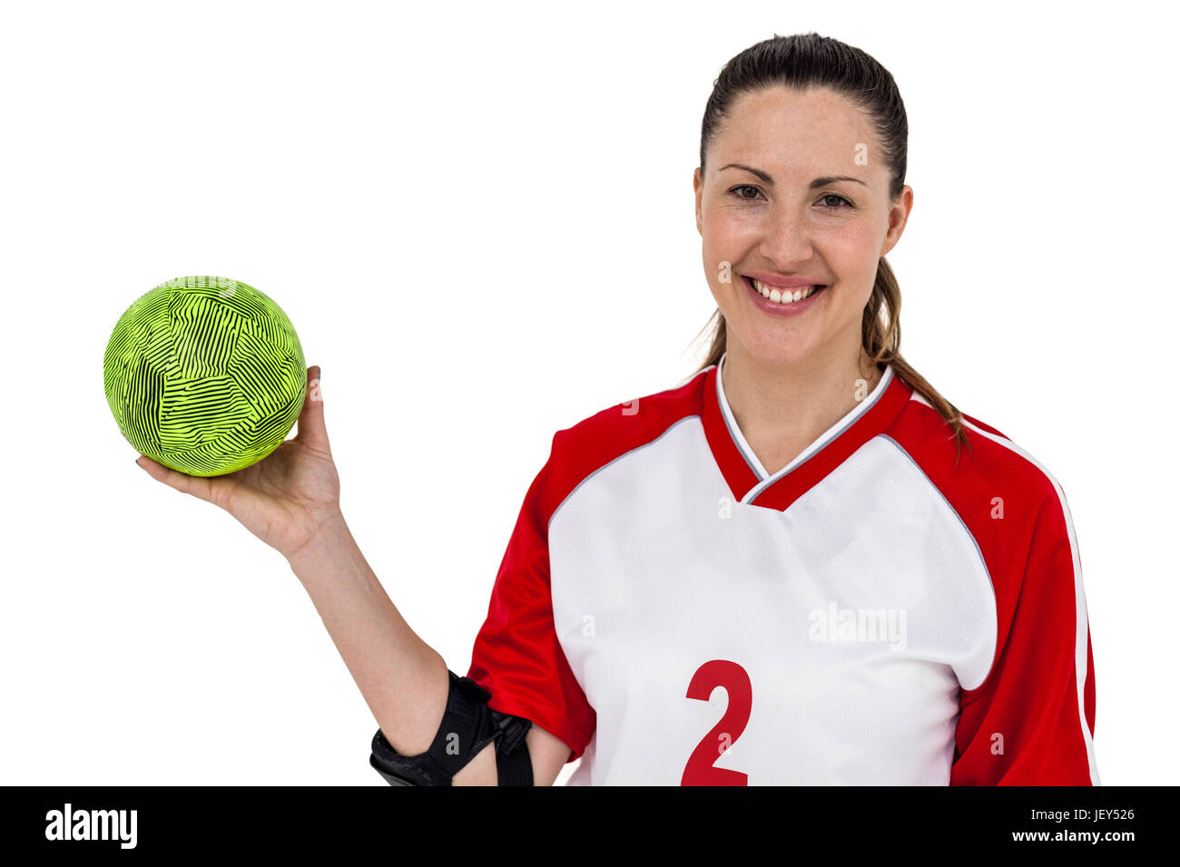 Sportswoman posing with ball Stock Photo - Alamy