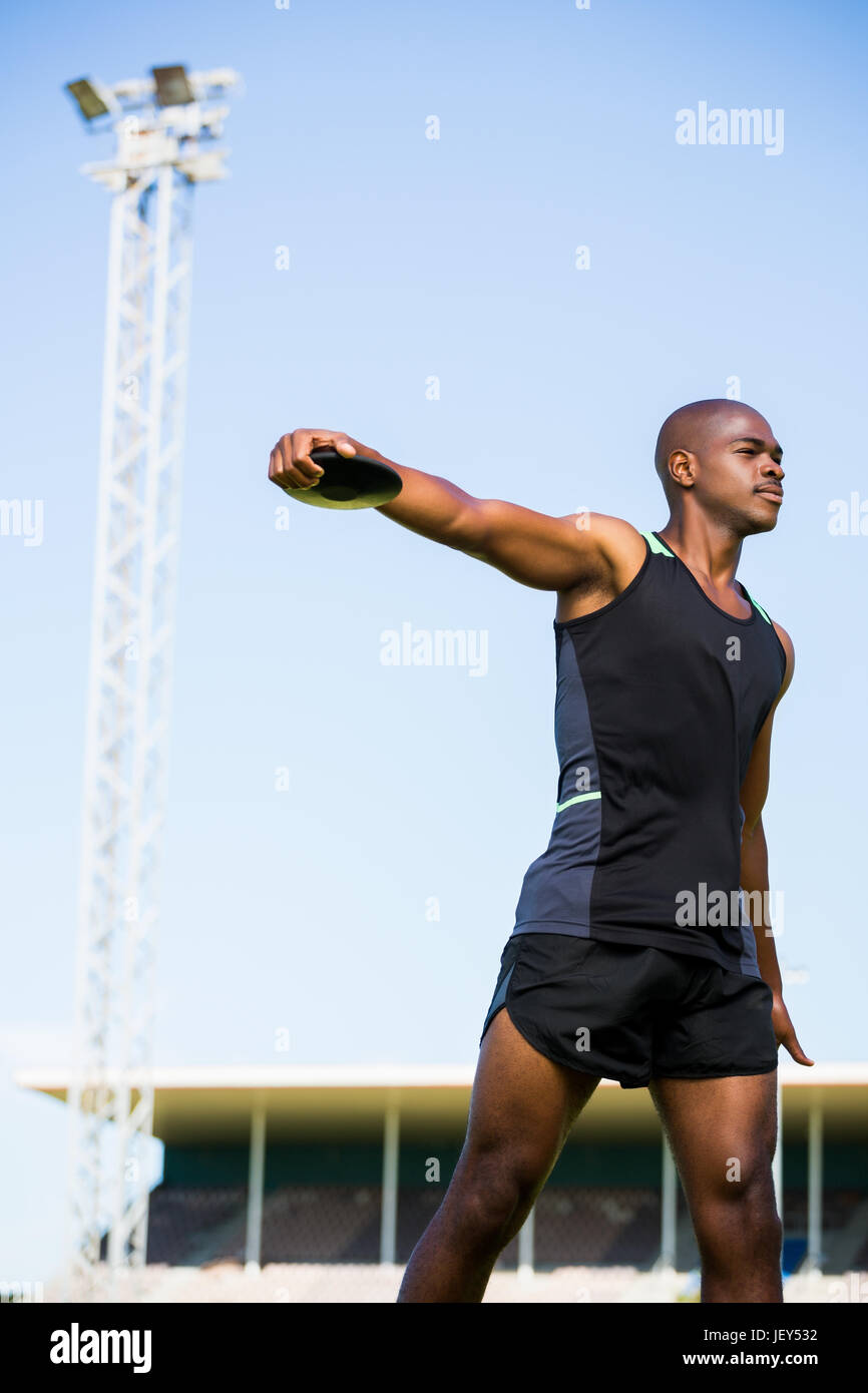 Athlete about to throw a discus Stock Photo - Alamy