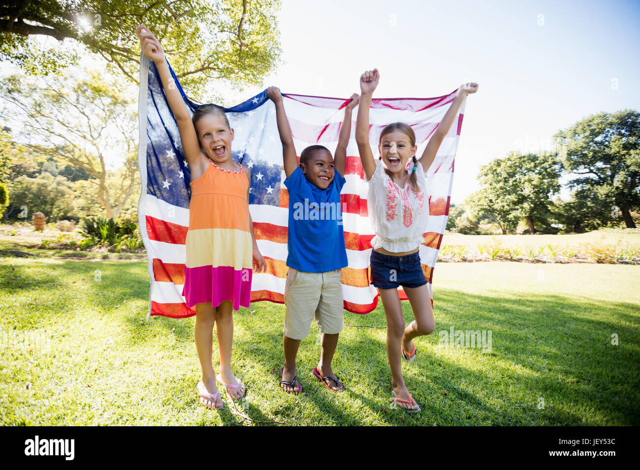 Happy children showing usa flag Stock Photo - Alamy