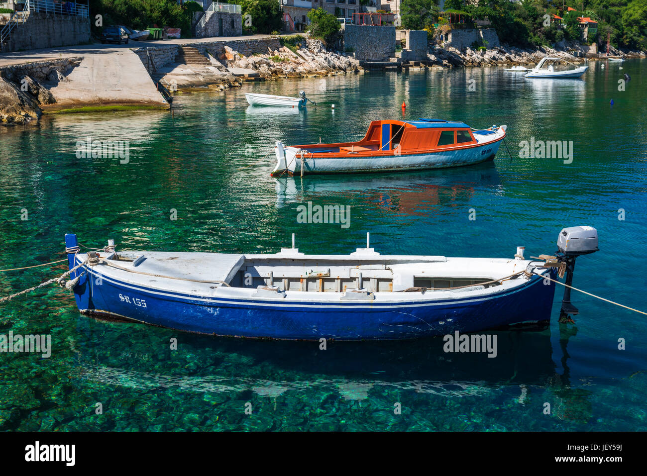 Fishing boats and blue waters in the village of Sobra, Mljet Island ...