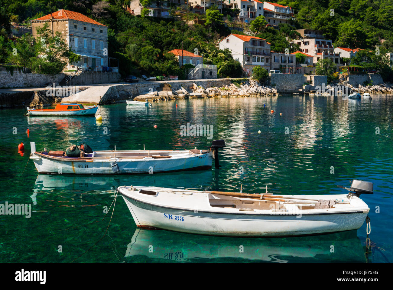 Fishing boats and blue waters in the village of Sobra, Mljet Island ...