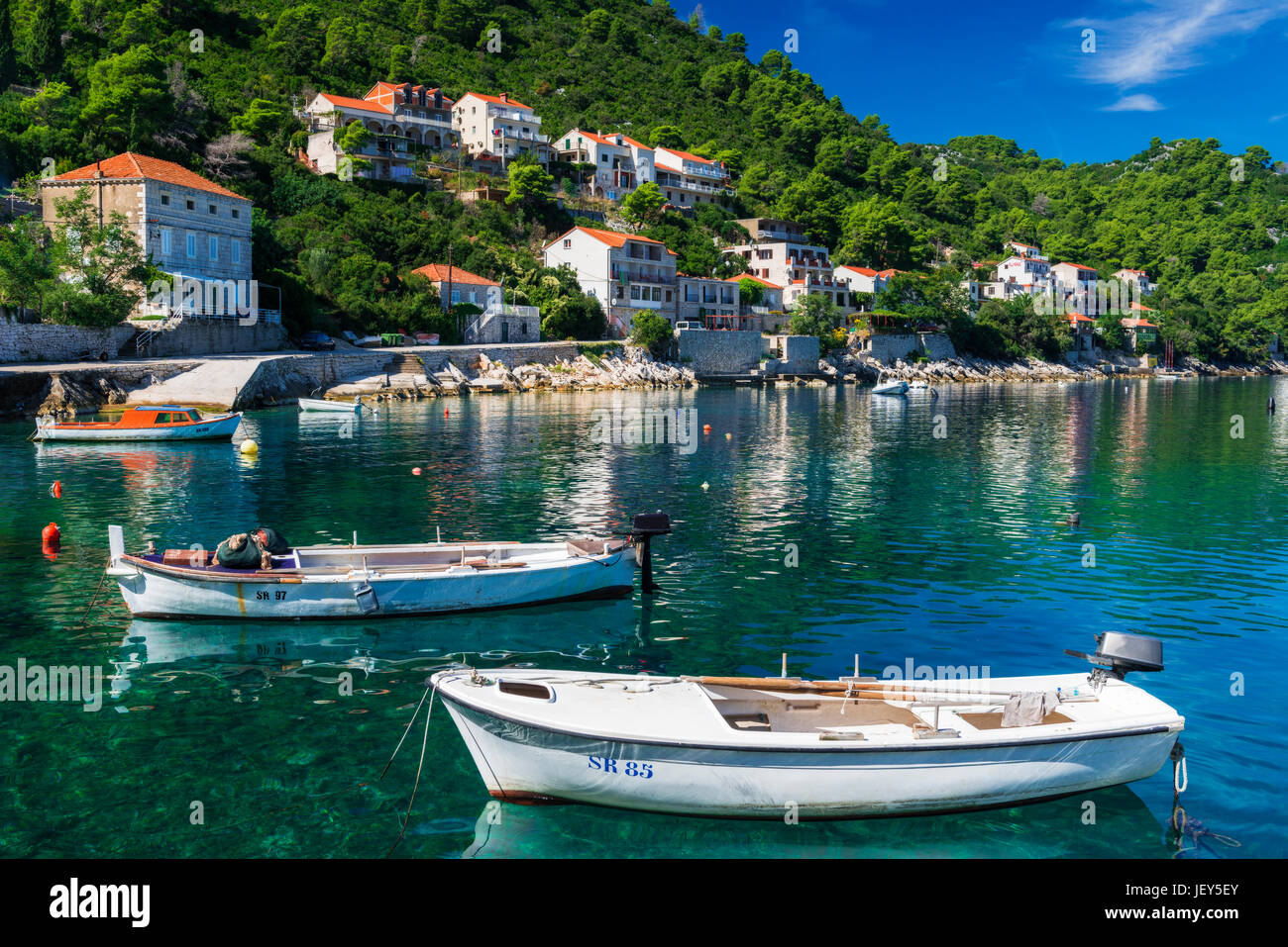 Fishing boats and blue waters in the village of Sobra, Mljet Island ...