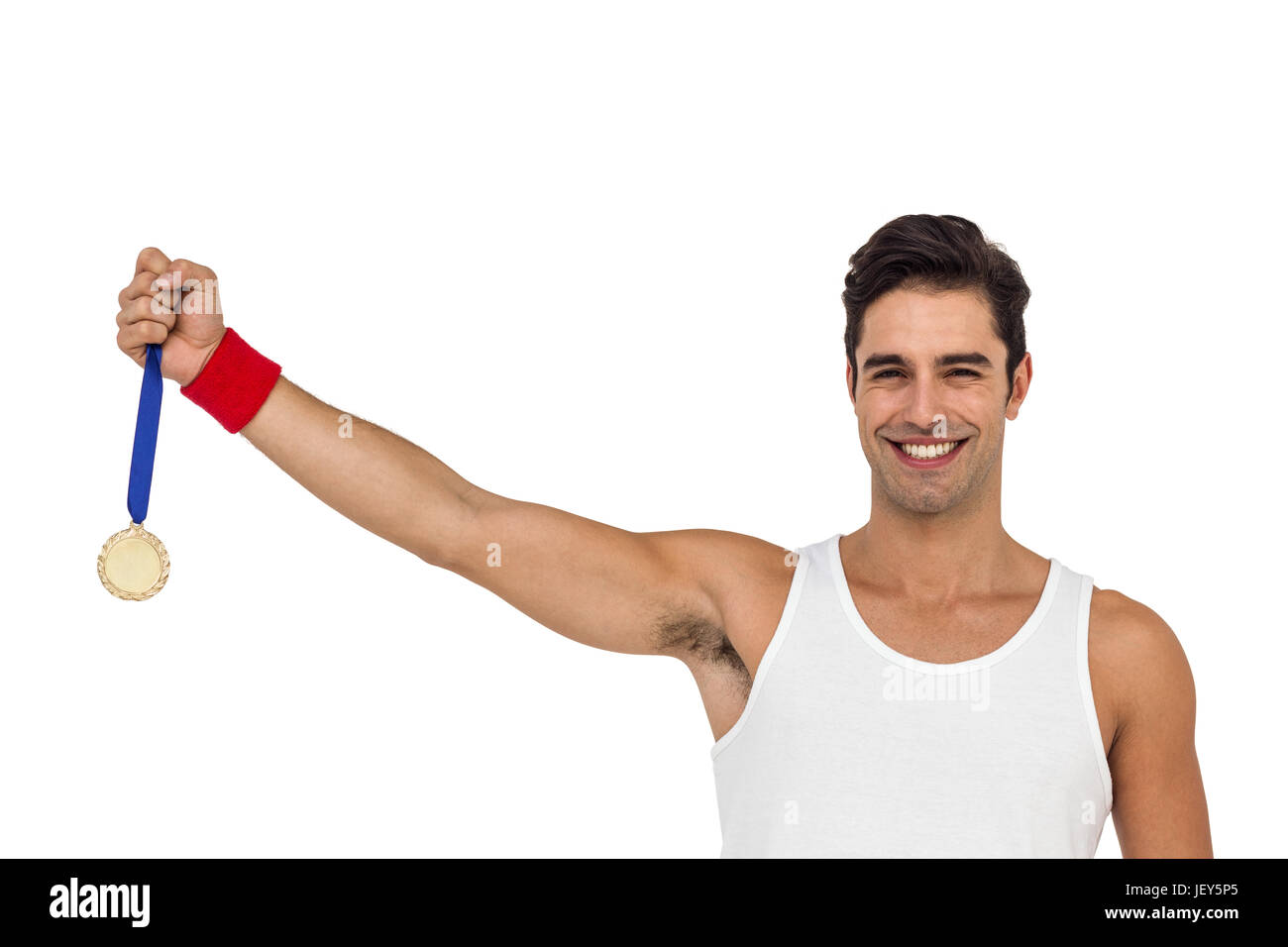 Athlete holding gold medal after victory Stock Photo - Alamy