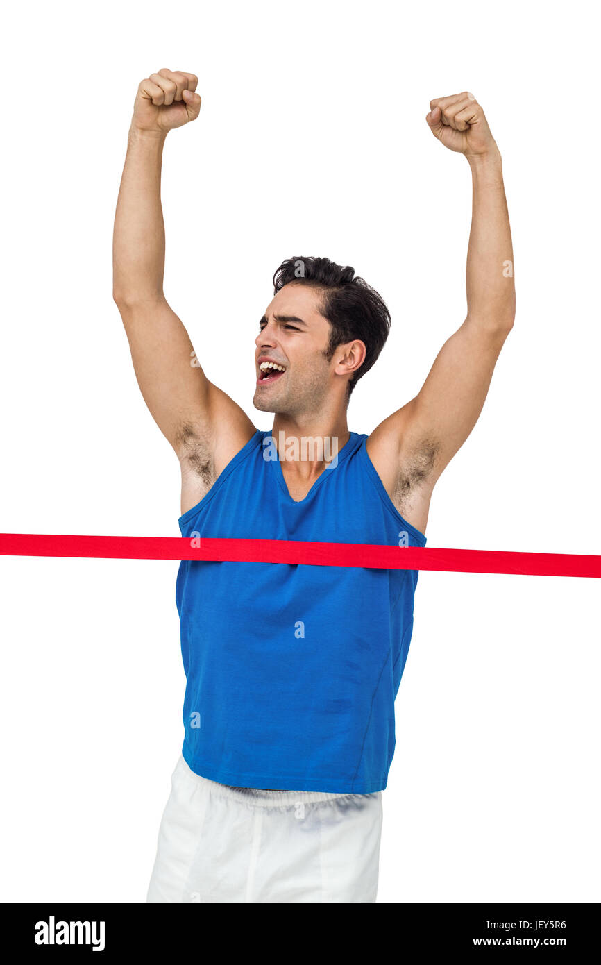Cheerful winner athlete crossing finish line Stock Photo - Alamy