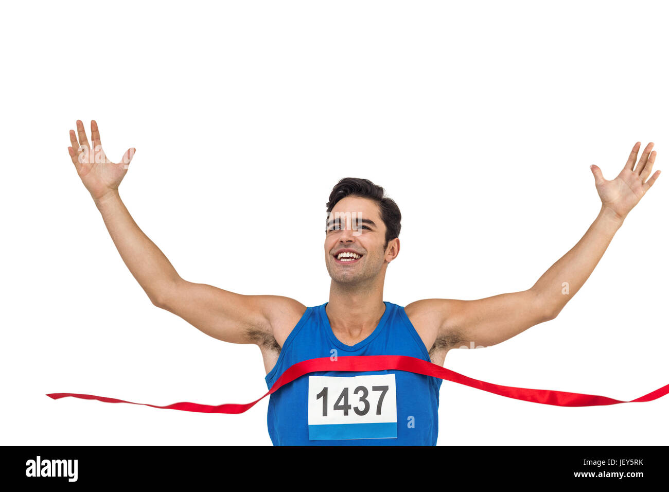 Cheerful winner athlete crossing finish line Stock Photo - Alamy