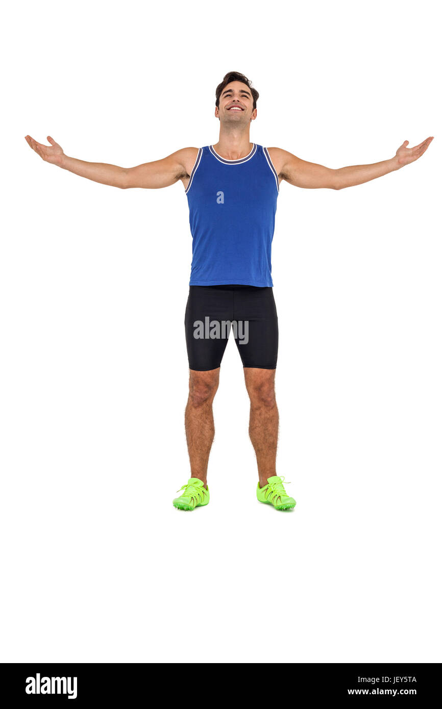 Athlete man standing with arms outstretched Stock Photo - Alamy
