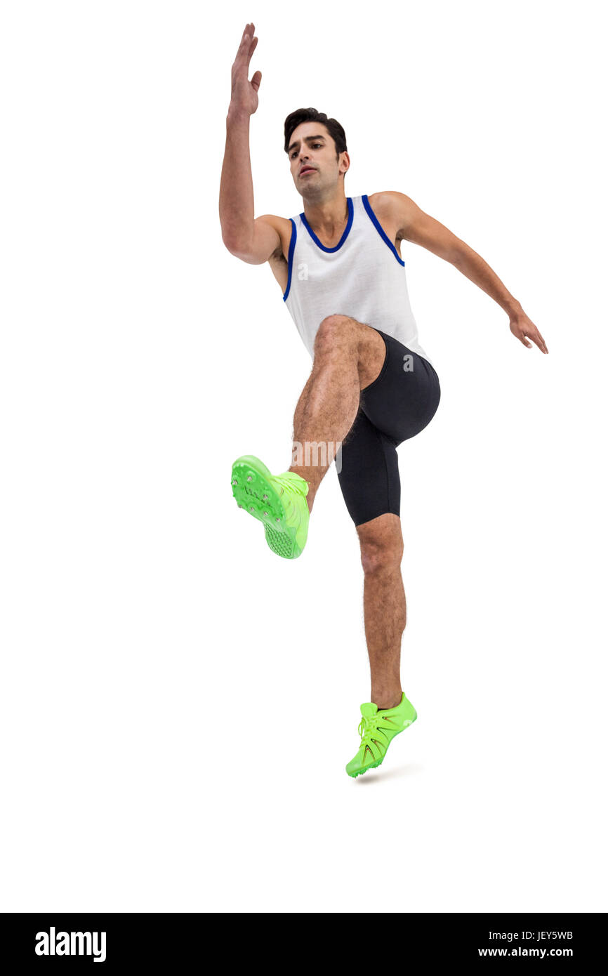 Male athlete running on white background Stock Photo - Alamy