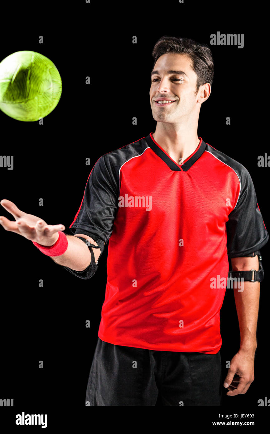 Confident athlete man playing with a ball Stock Photo - Alamy