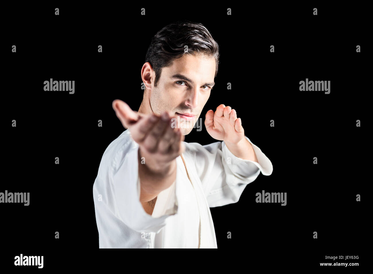 Portrait of fighter performing karate stance Stock Photo - Alamy