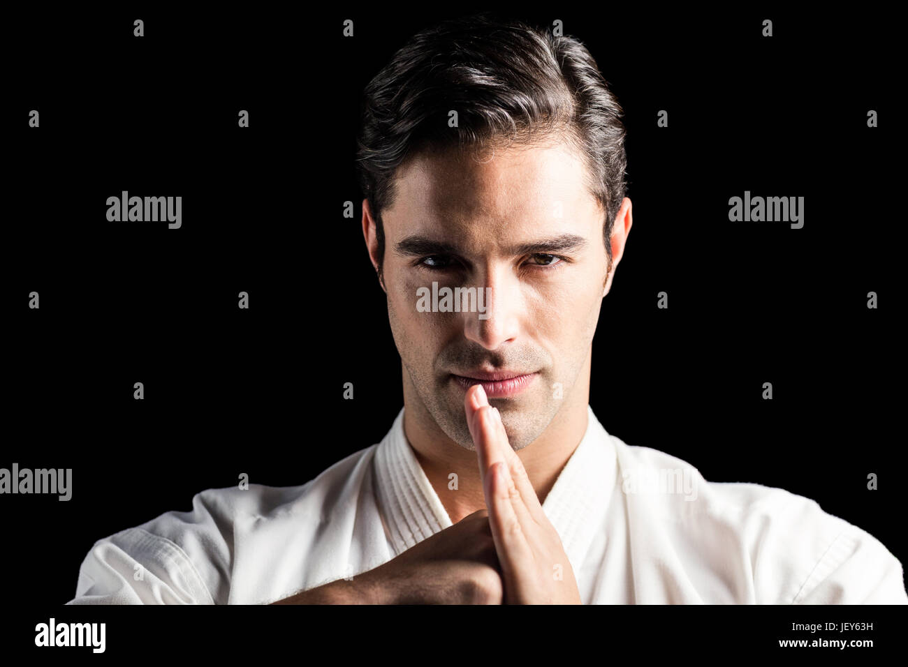 Portrait of fighter performing hand salute Stock Photo - Alamy