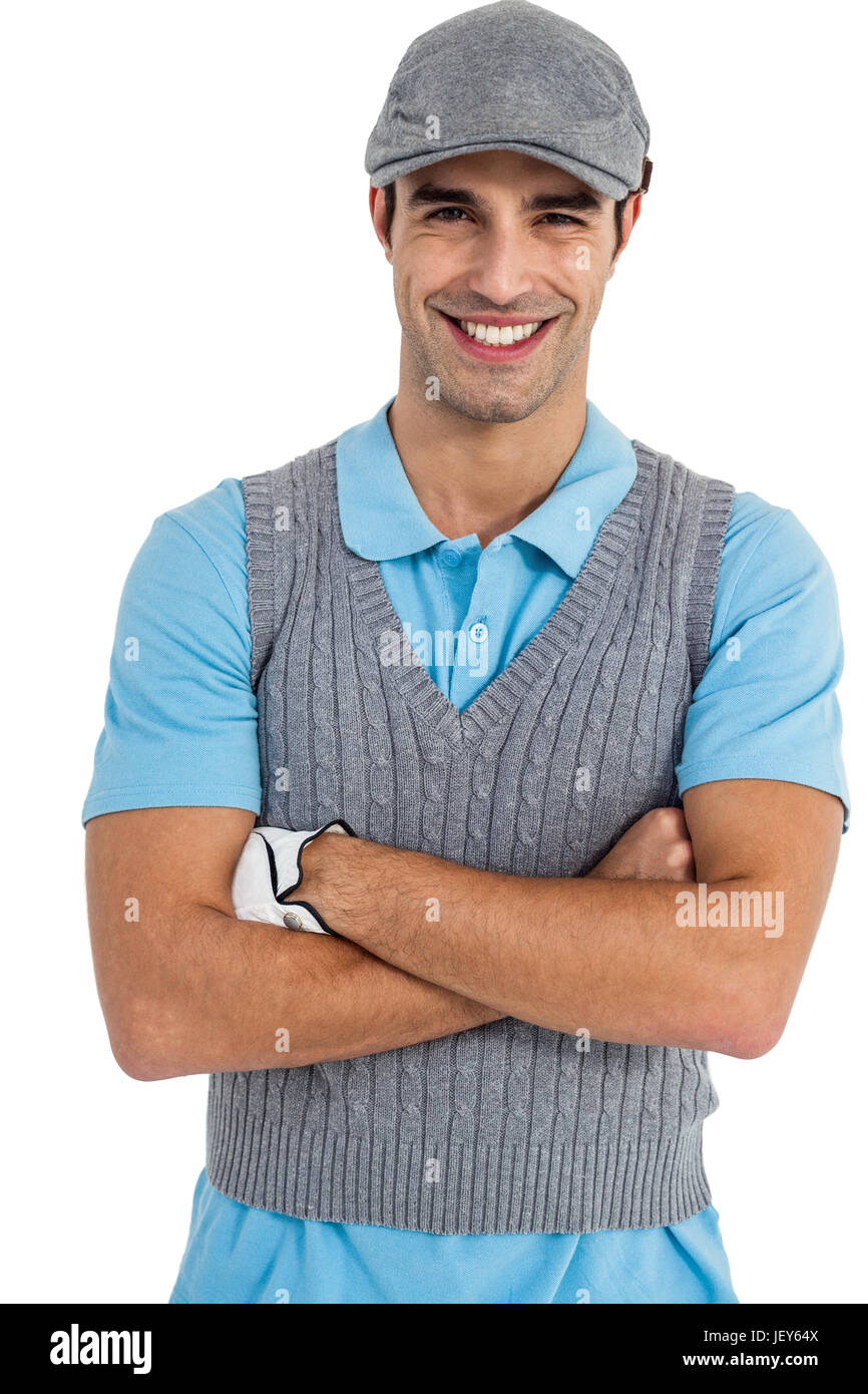 Golf player standing with arms crossed Stock Photo - Alamy
