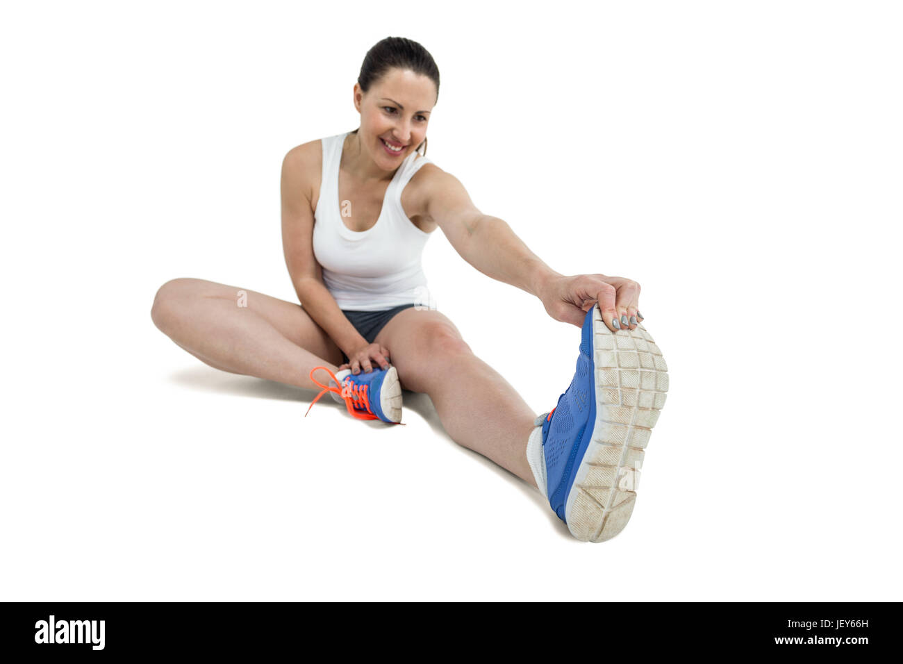 Athlete woman stretching her hamstring Stock Photo - Alamy
