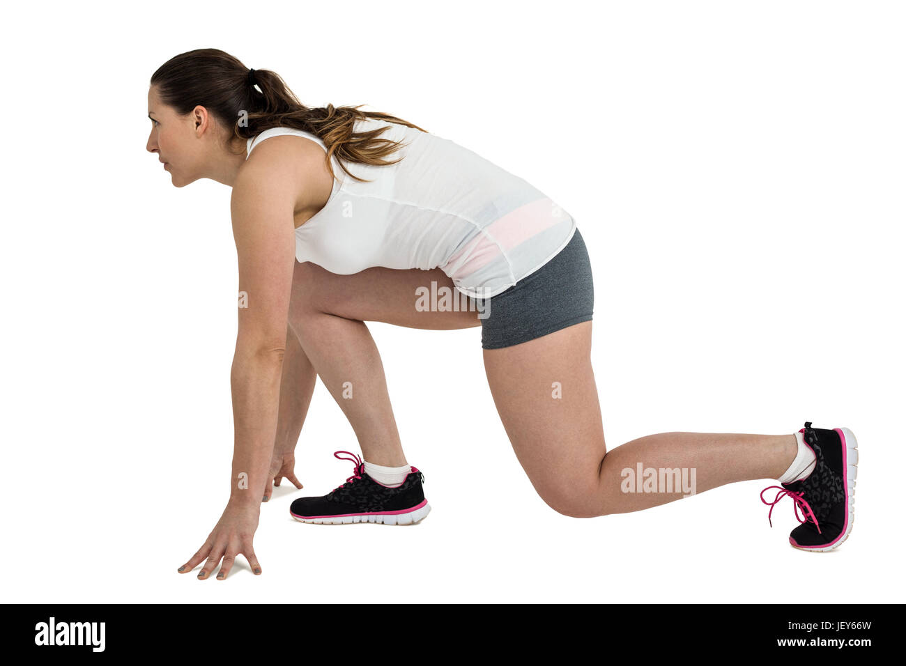 Athlete woman in ready to run position Stock Photo - Alamy
