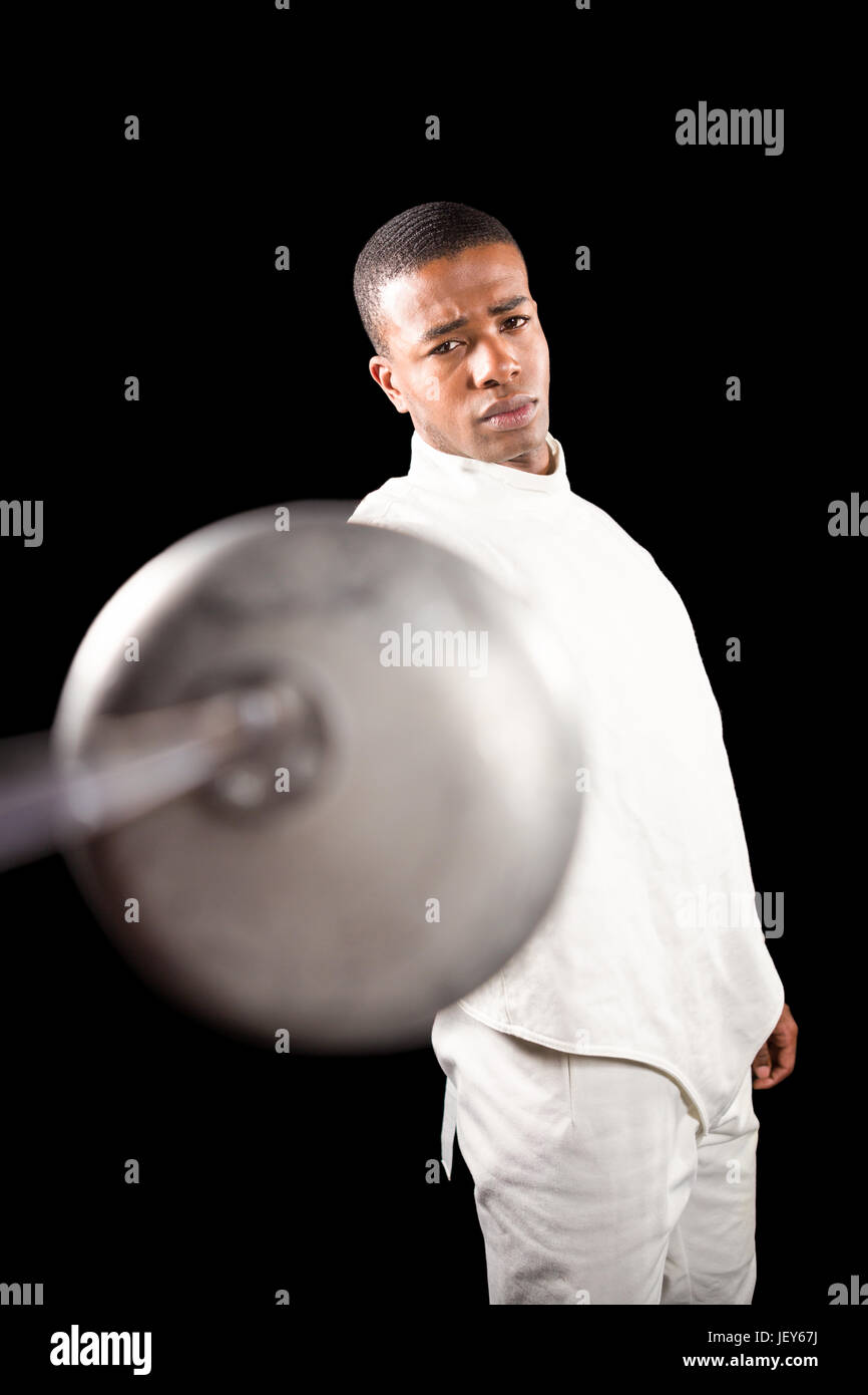 Swordsman practicing with fencing sword Stock Photo - Alamy