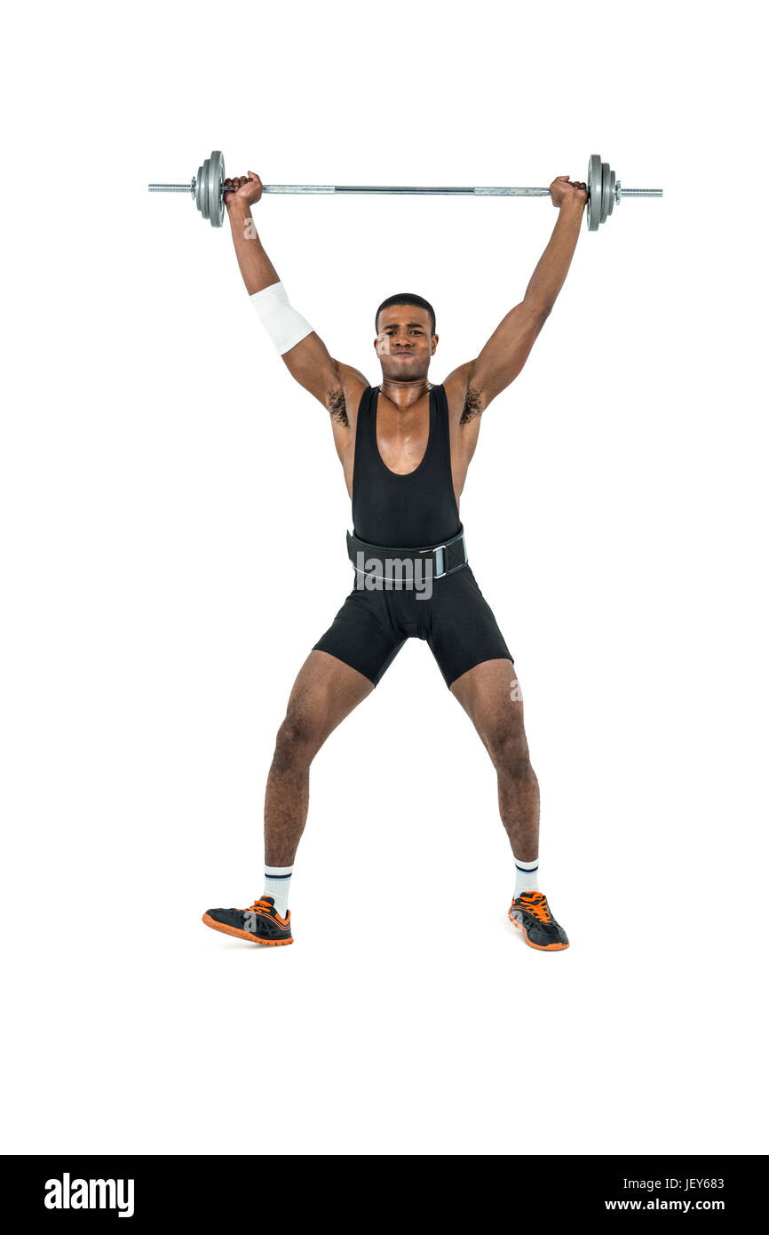 Bodybuilder lifting heavy barbell weights Stock Photo - Alamy