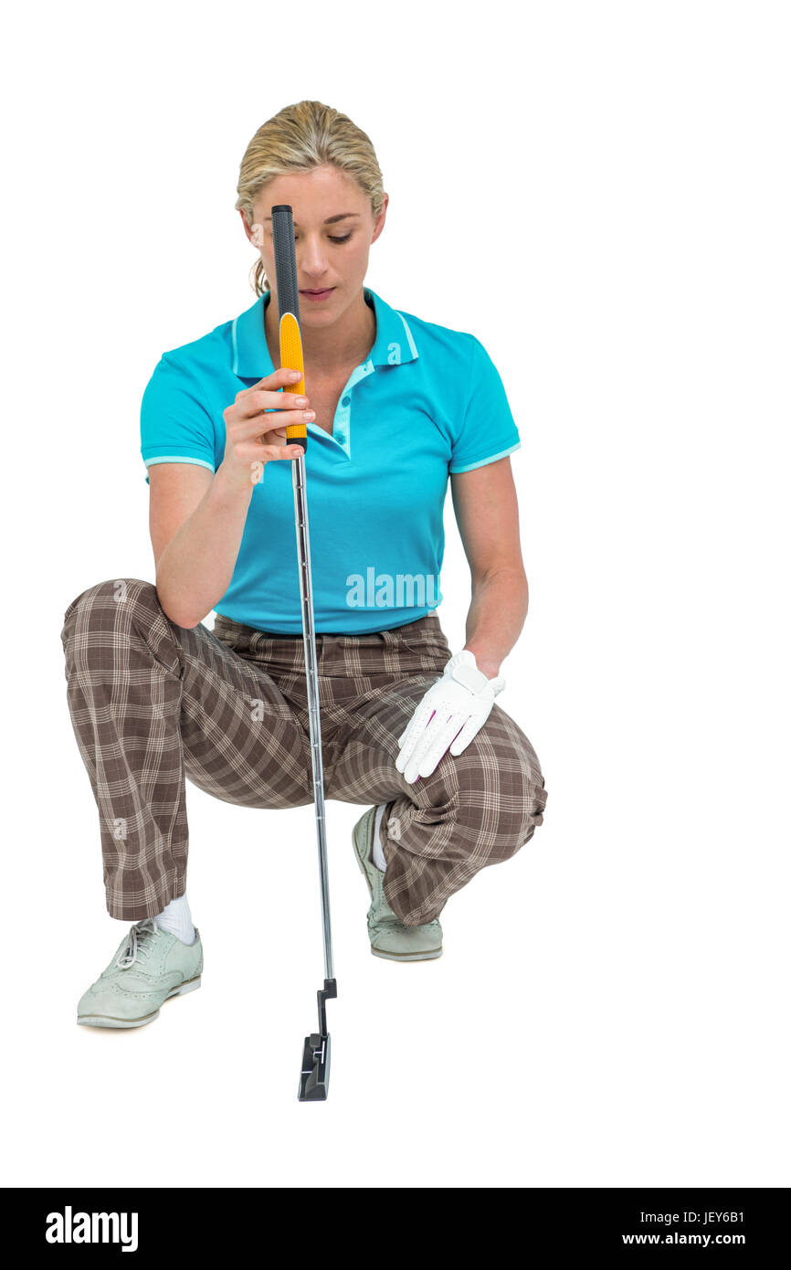 Golf player holding a golf club Stock Photo - Alamy