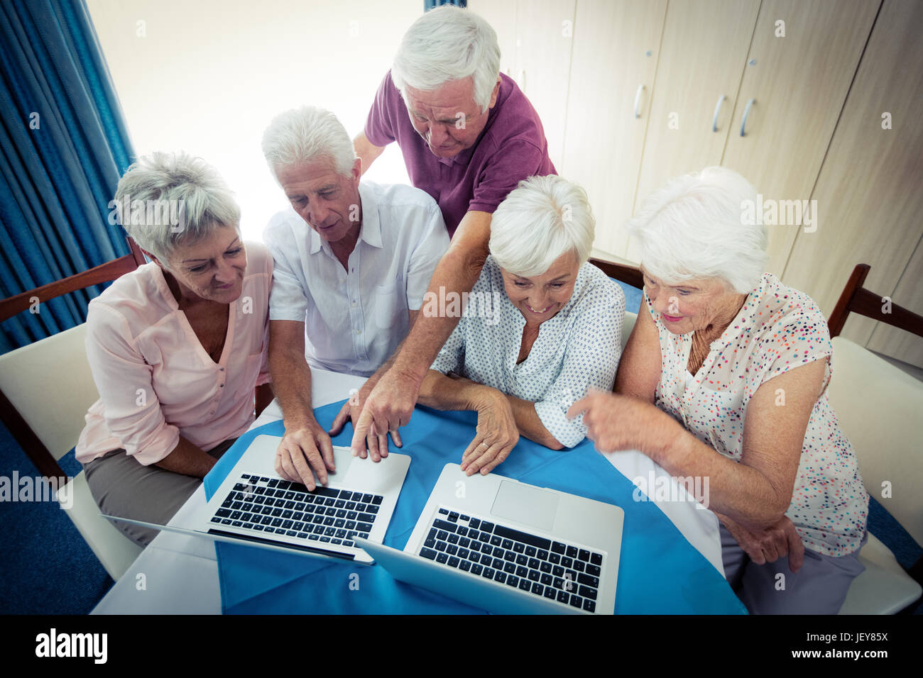 Group of seniors using a computer Stock Photo - Alamy