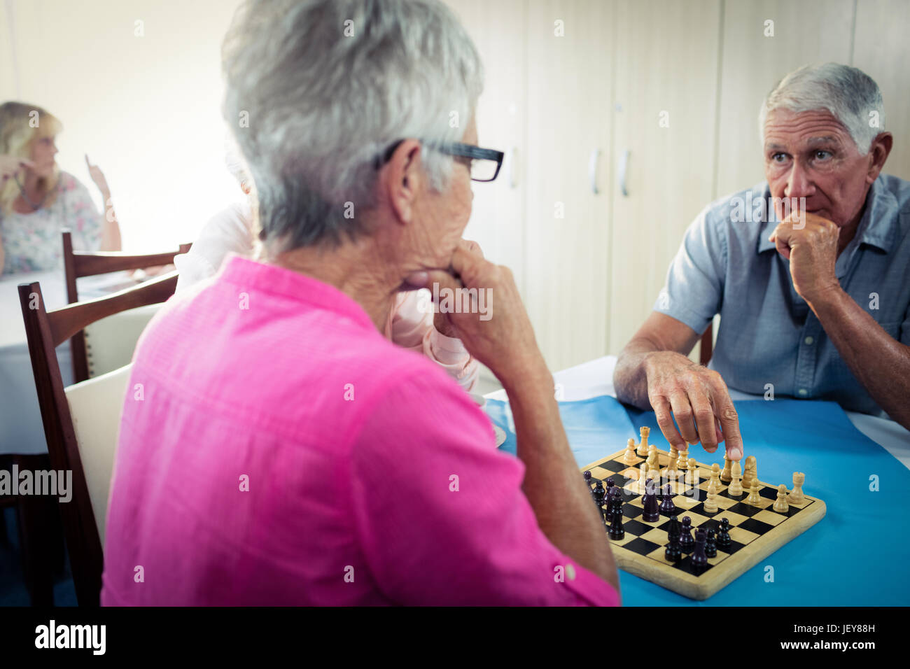 Seniors playing chess Stock Photo - Alamy