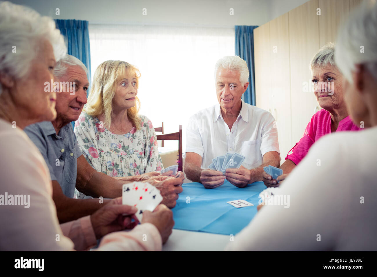 Group of seniors playing cards Stock Photo - Alamy