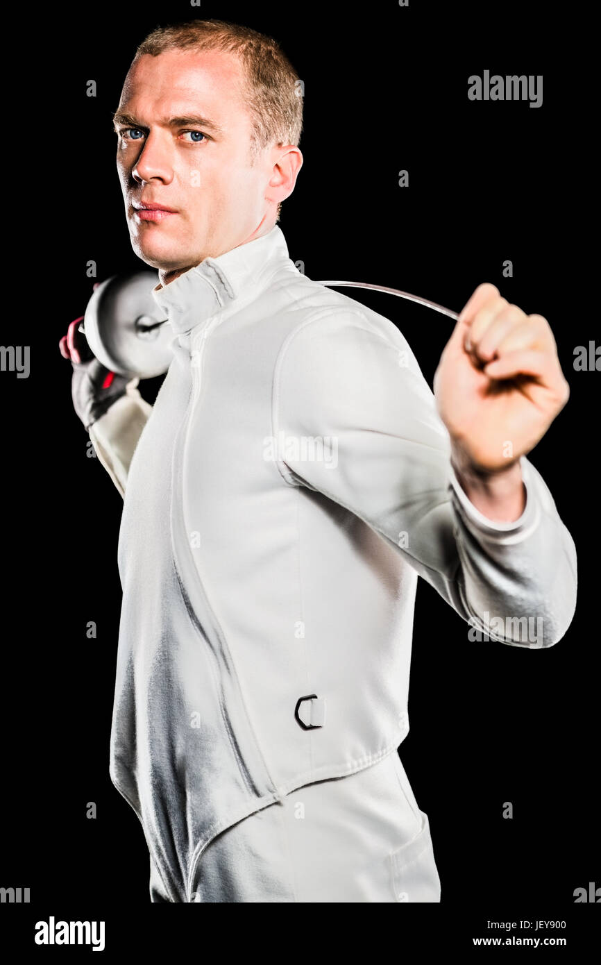 Swordsman holding fencing sword Stock Photo - Alamy