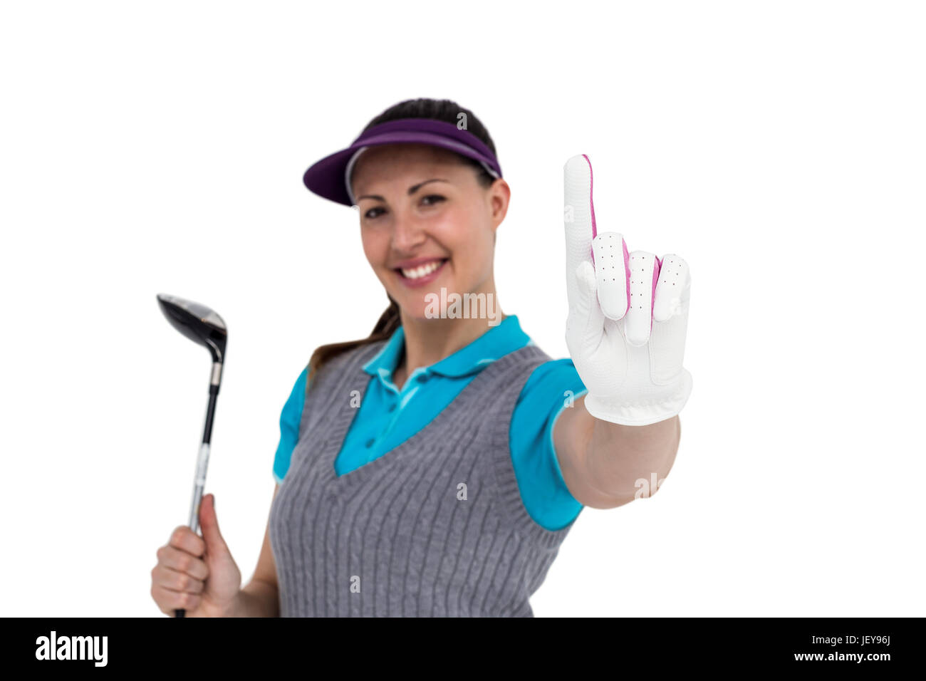 Golf player posing with golf club Stock Photo - Alamy