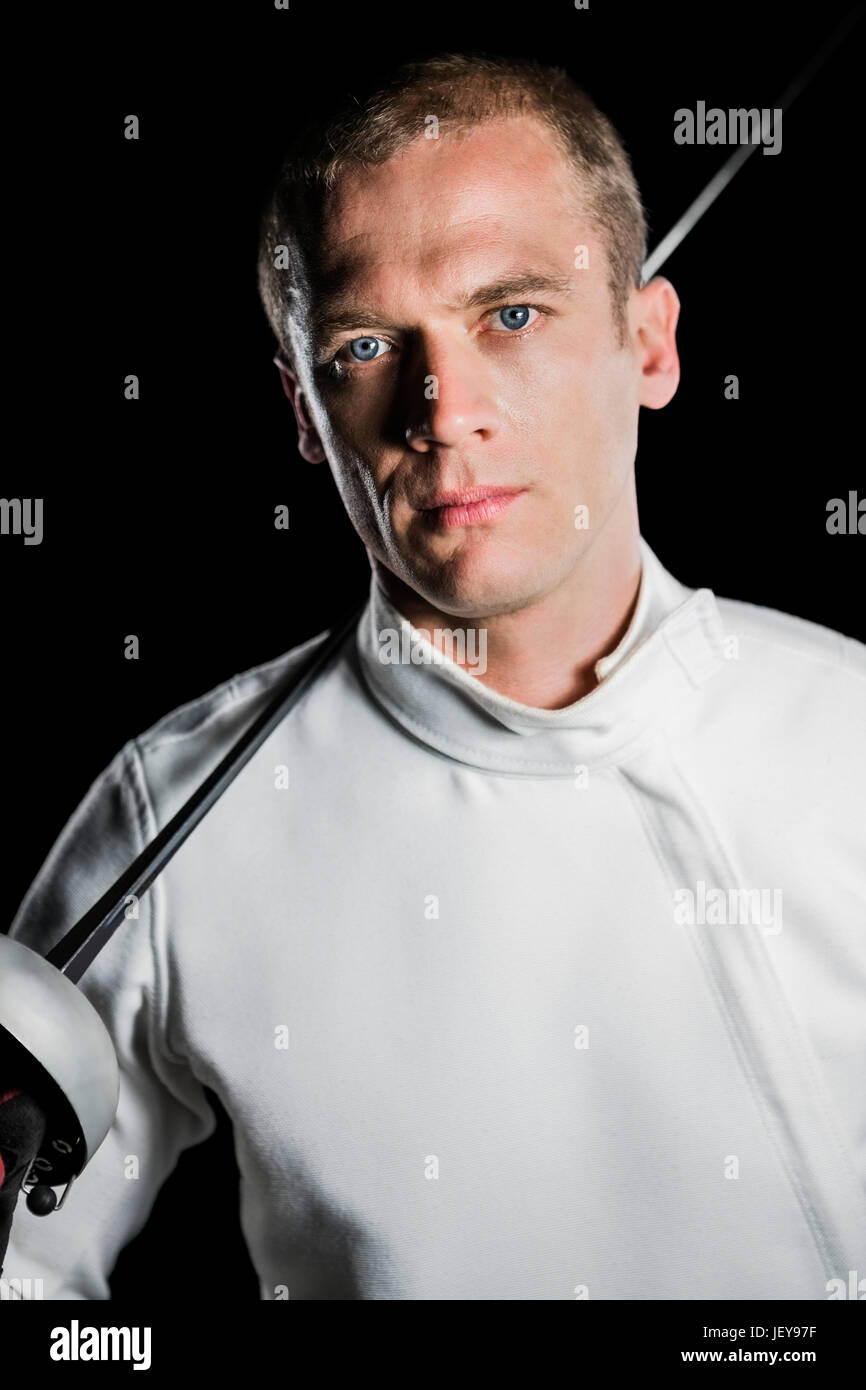 Close-up of swordsman holding fencing sword Stock Photo - Alamy