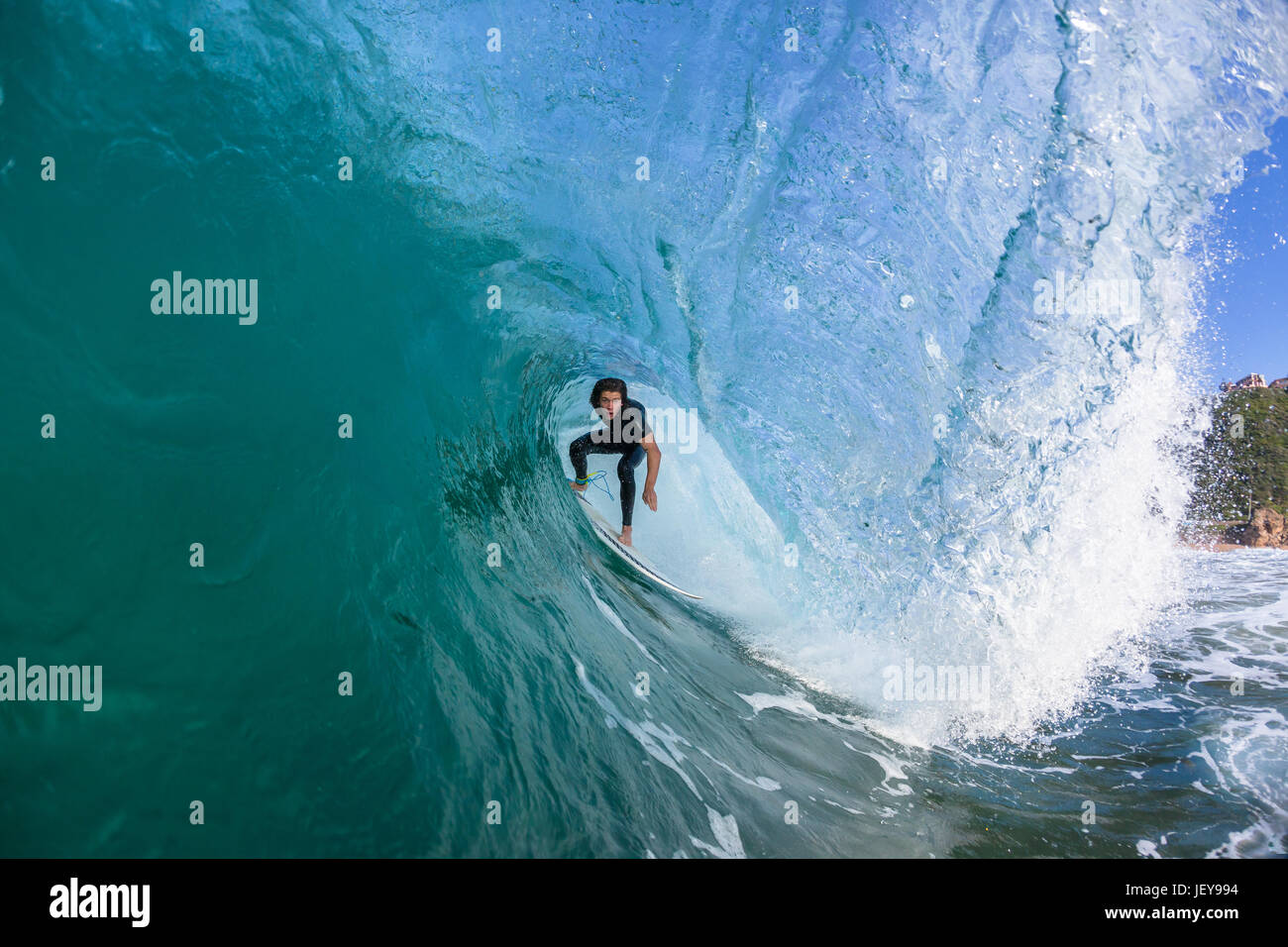 Surfer surfing hollow wave tube ride closeup up water action photo ...