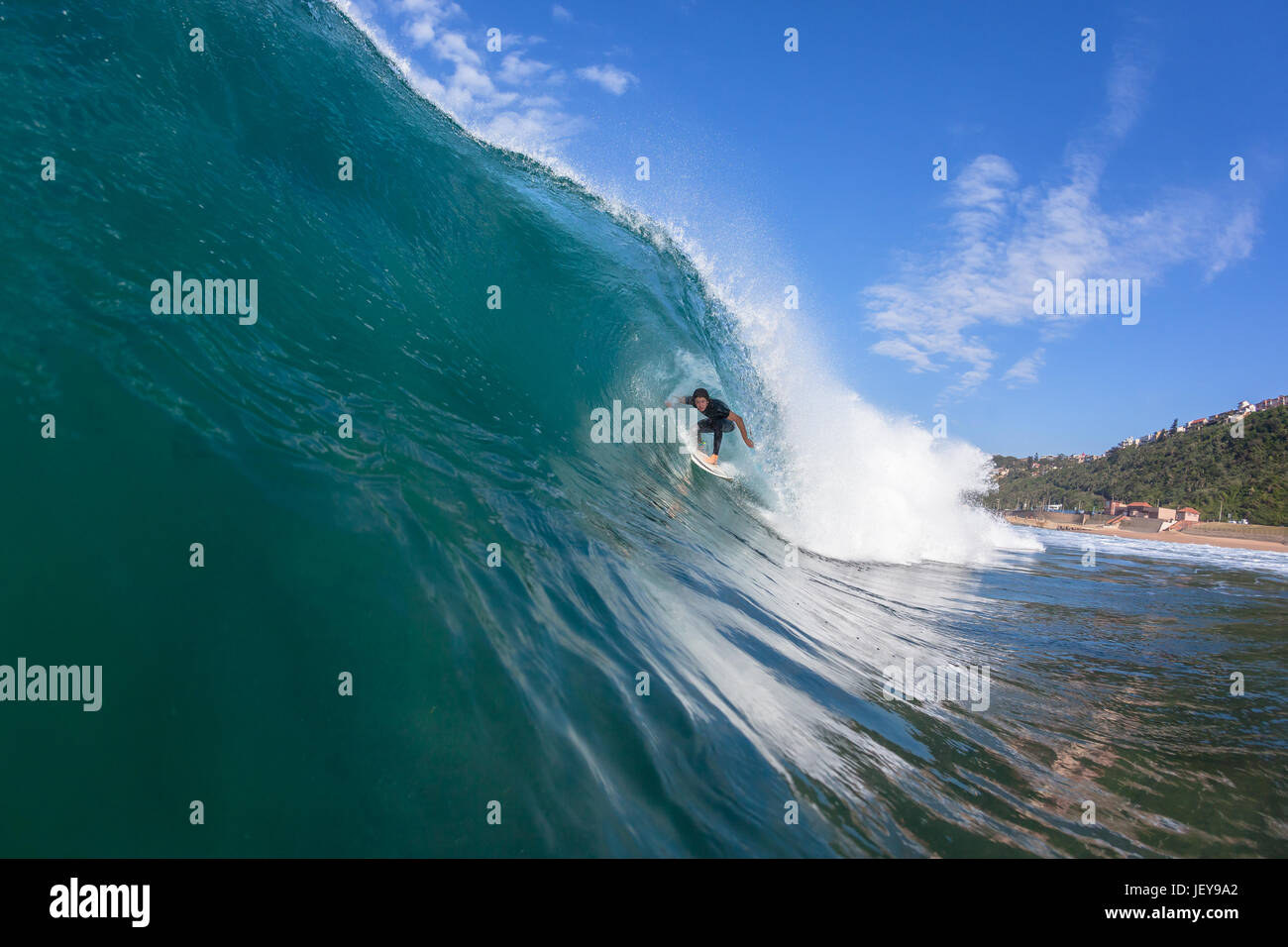 Surfer surfing hollow wave tube ride closeup up water action photo ...