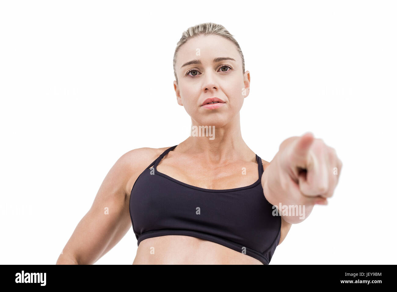 Female athlete pointing the camera Stock Photo - Alamy