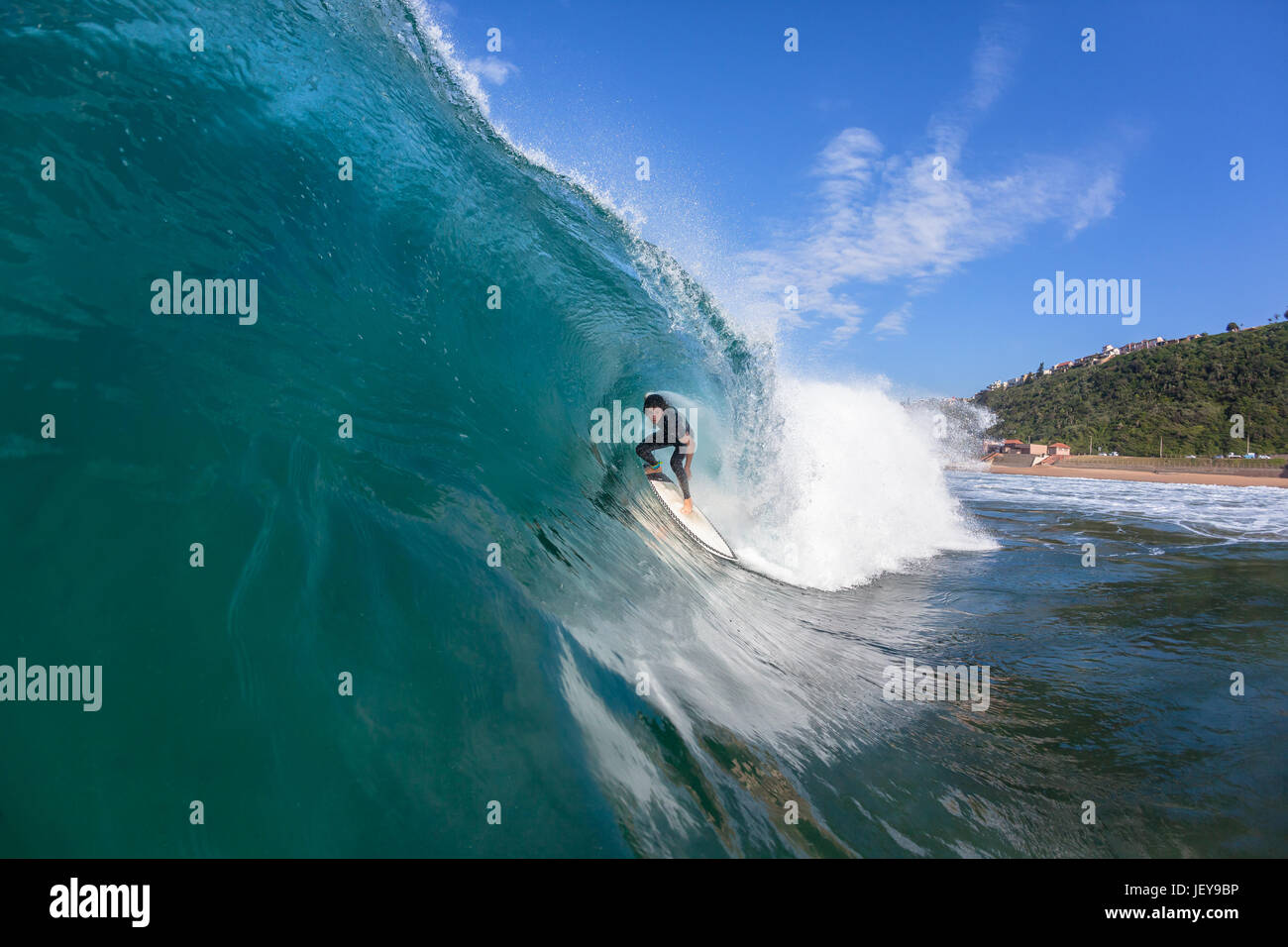 Surfer surfing hollow wave tube ride closeup up water action photo ...
