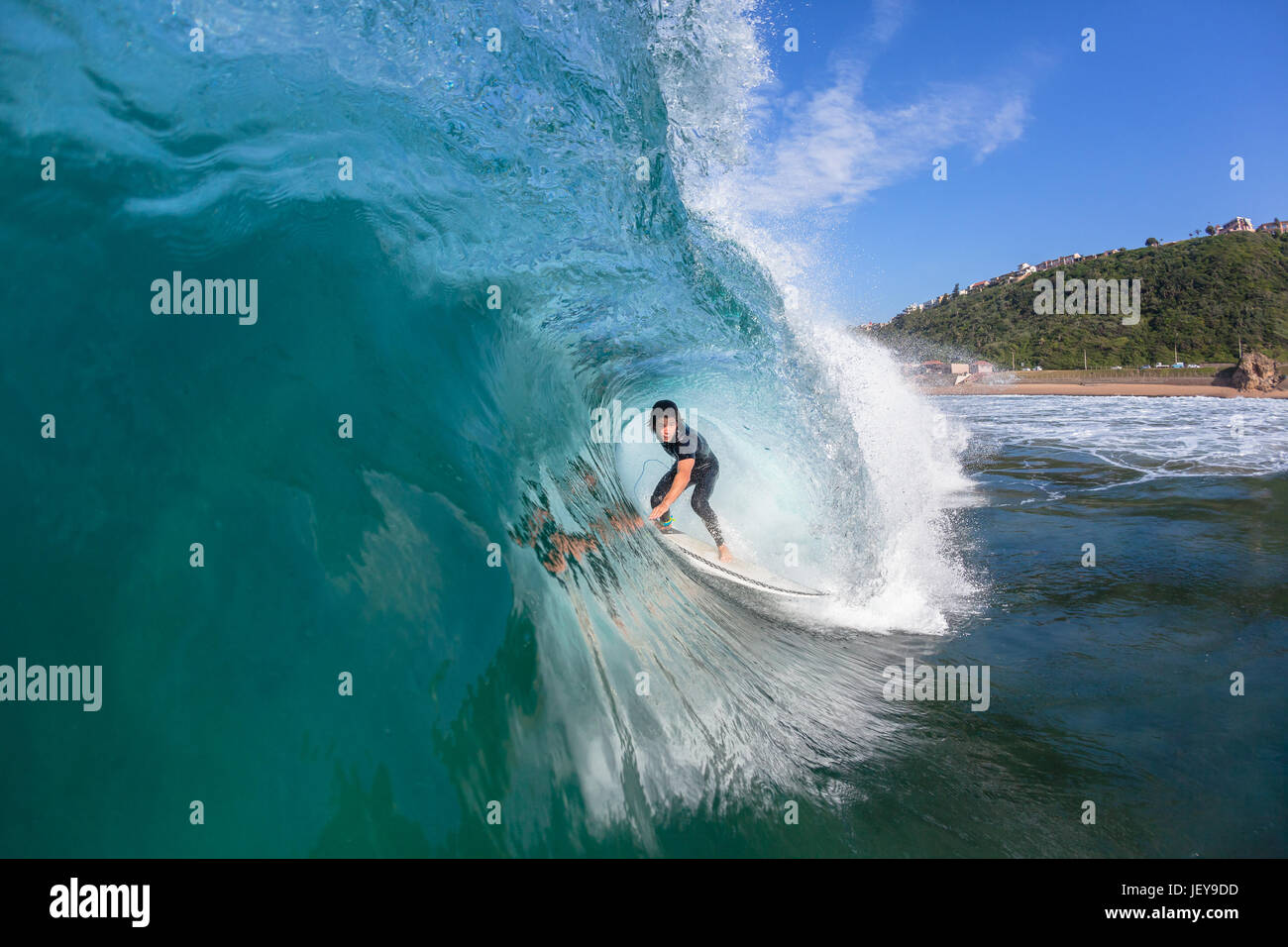 Surfer surfing hollow wave tube ride closeup up water action photo ...