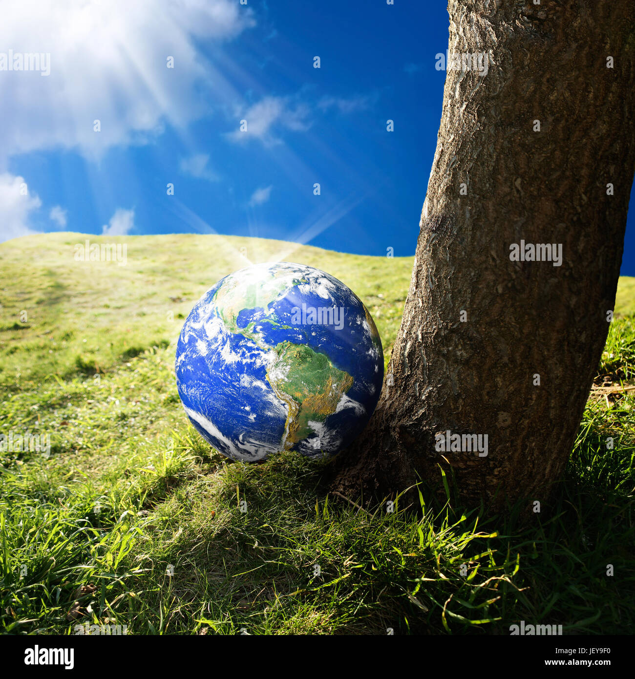 conceptual image of world on green landscape. NASA world map image ...