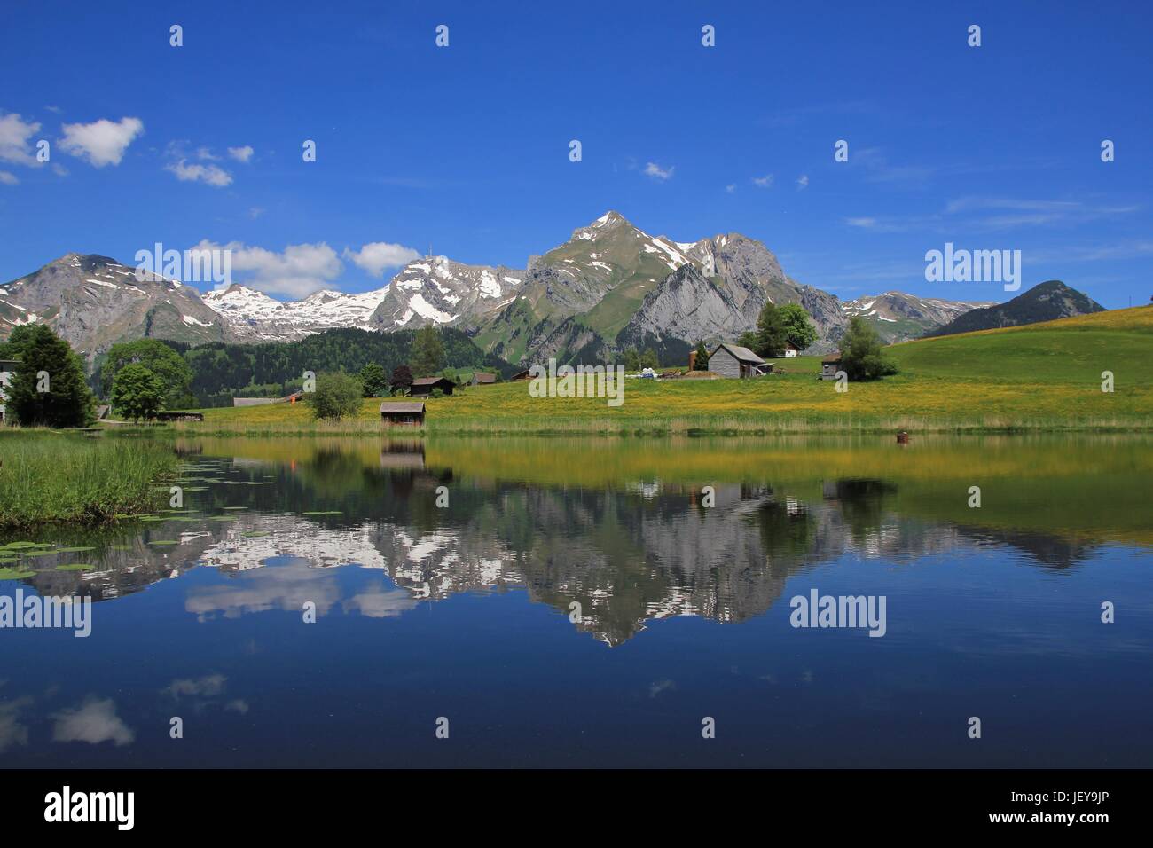 Alpstein range mirroring in lake Schwendisee Stock Photo - Alamy
