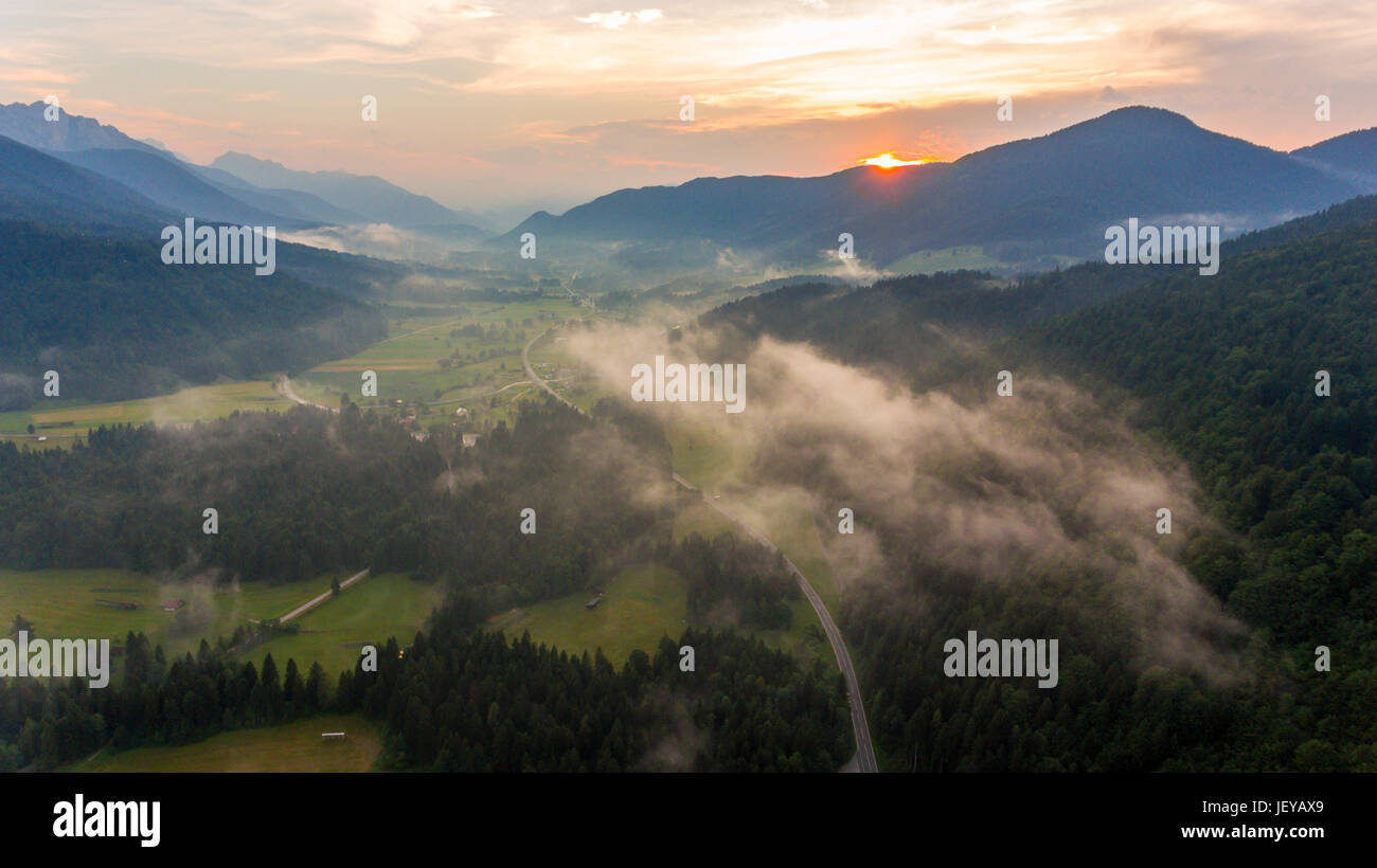Aerial view of sunrise over a valley Stock Photo - Alamy
