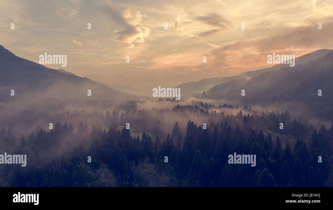 Aerial view of sunrise over a valley Stock Photo - Alamy
