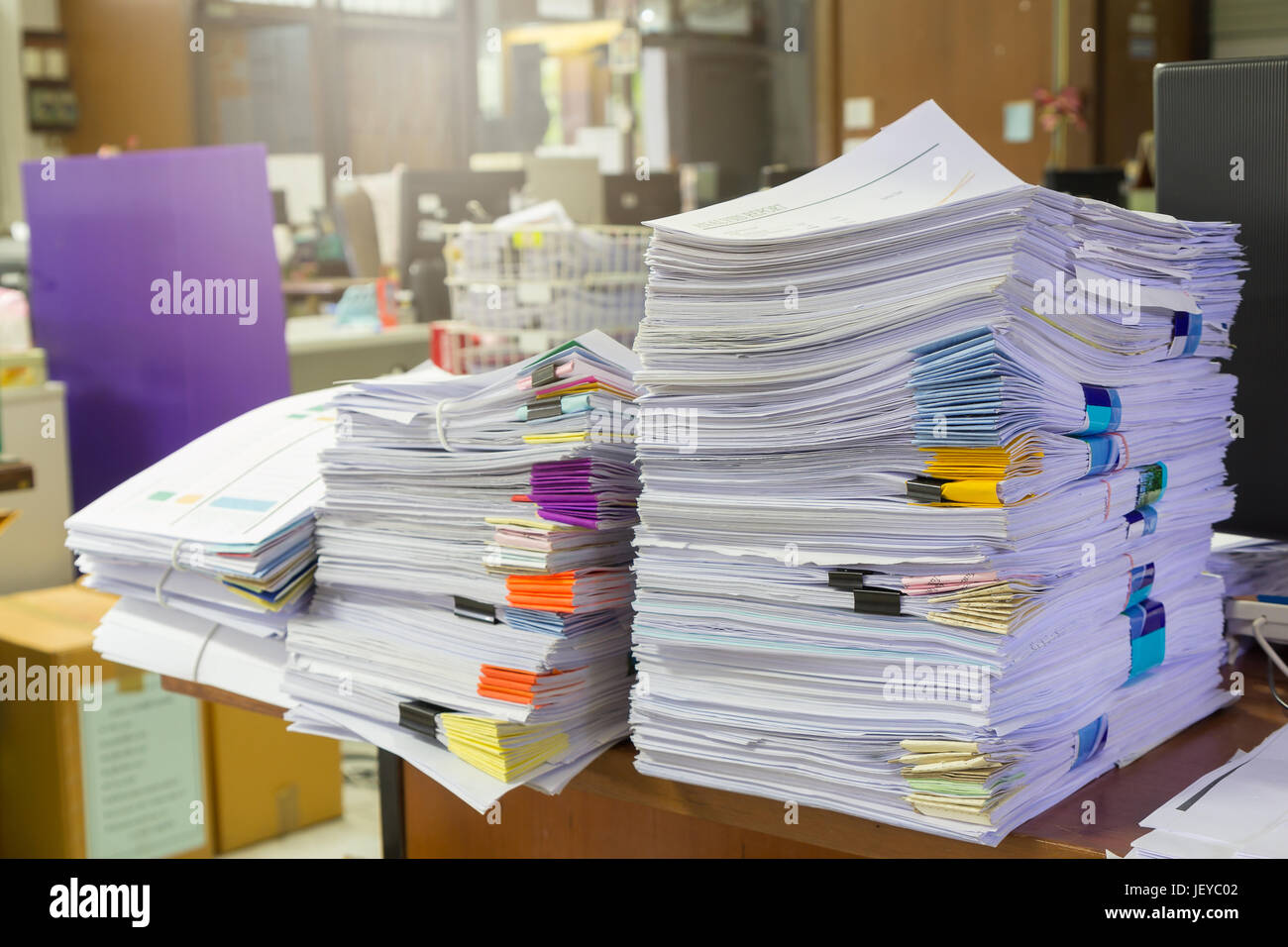 Pile of unfinished documents on office desk, Stack of business paper ...