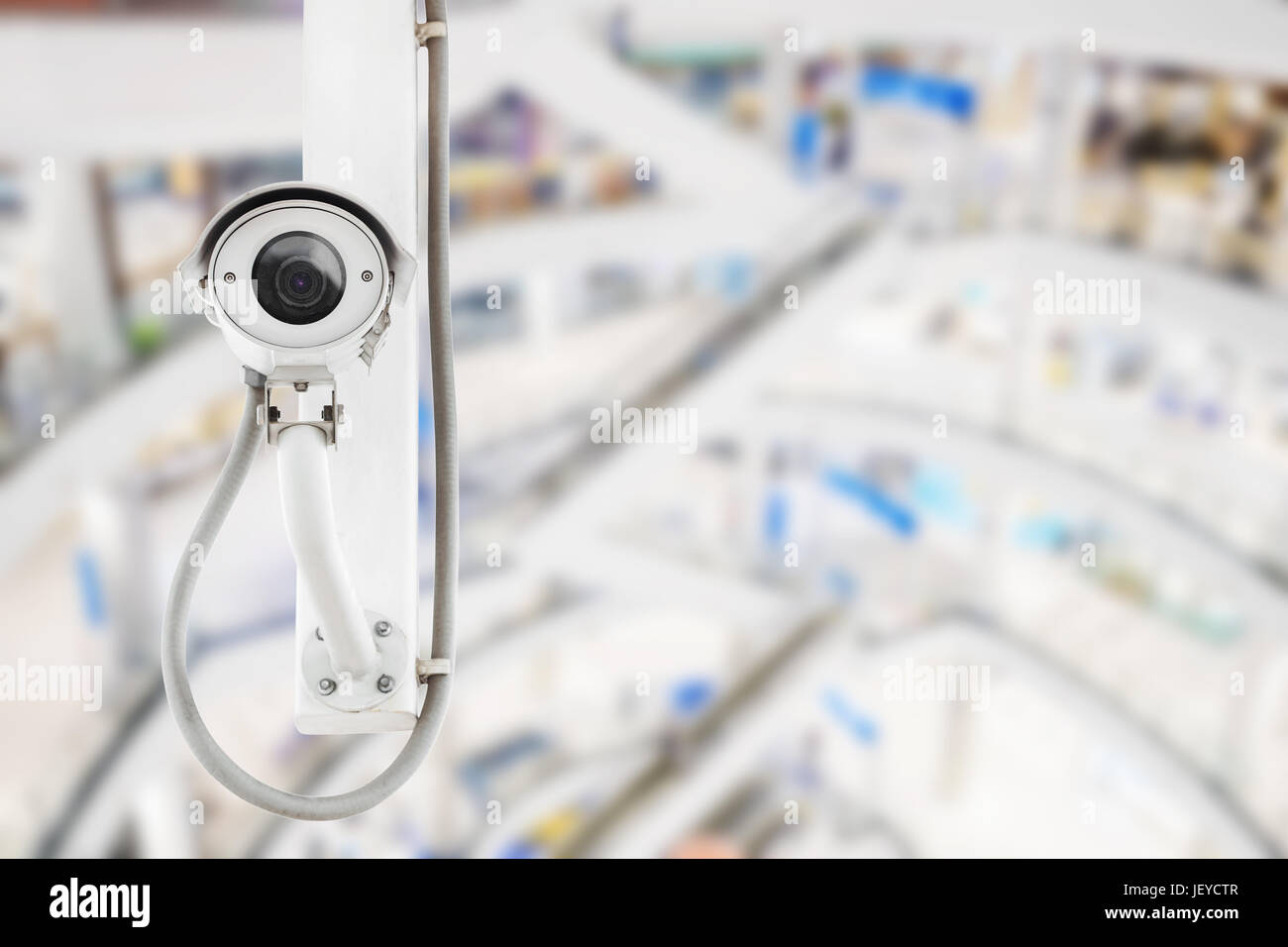CCTV security camera with blurred shopping mall background Stock Photo ...