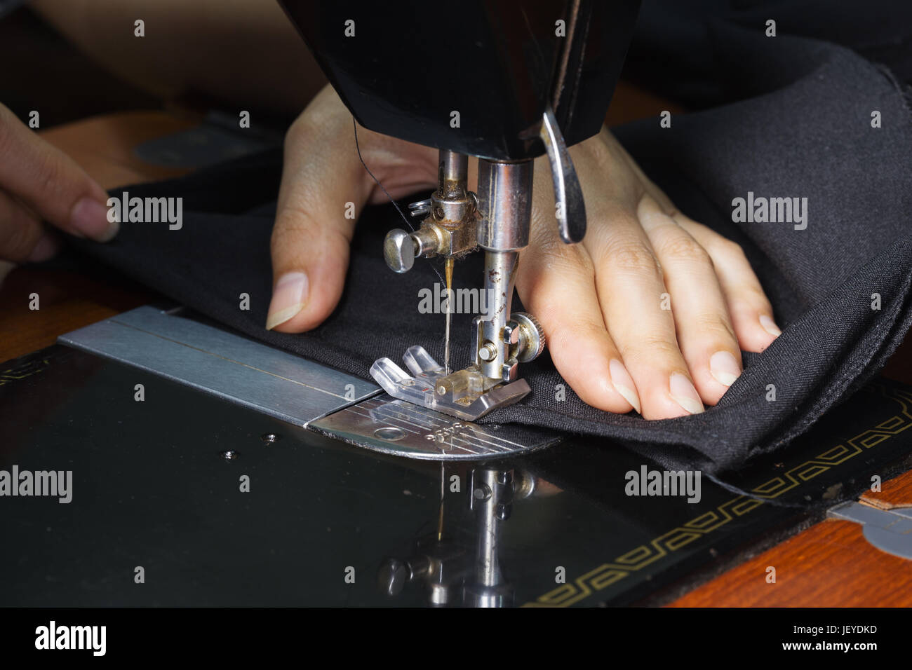 close-up hand working with old sewing machine Stock Photo - Alamy