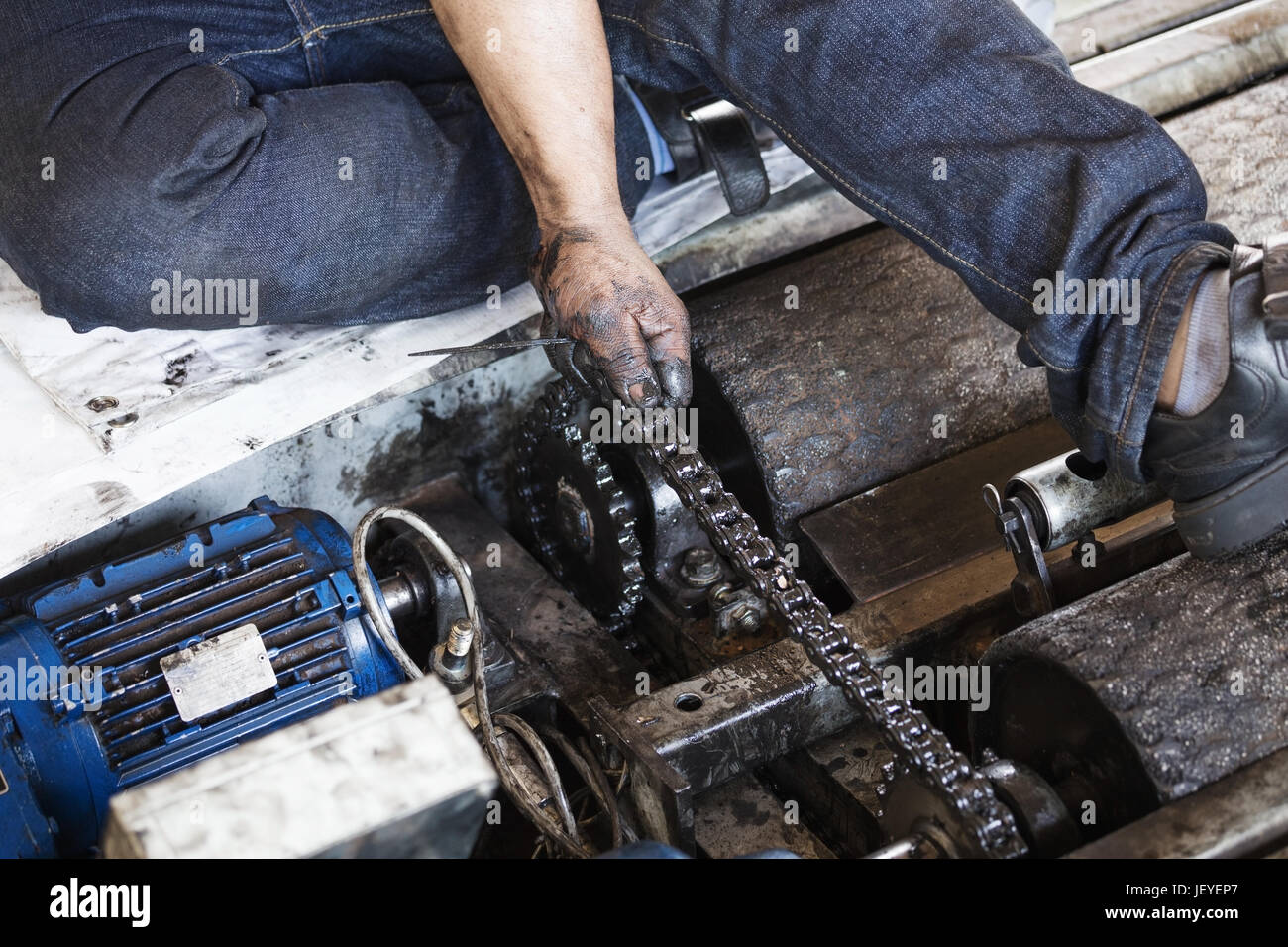 Hand of repairman during maintenance work of chain Stock Photo - Alamy