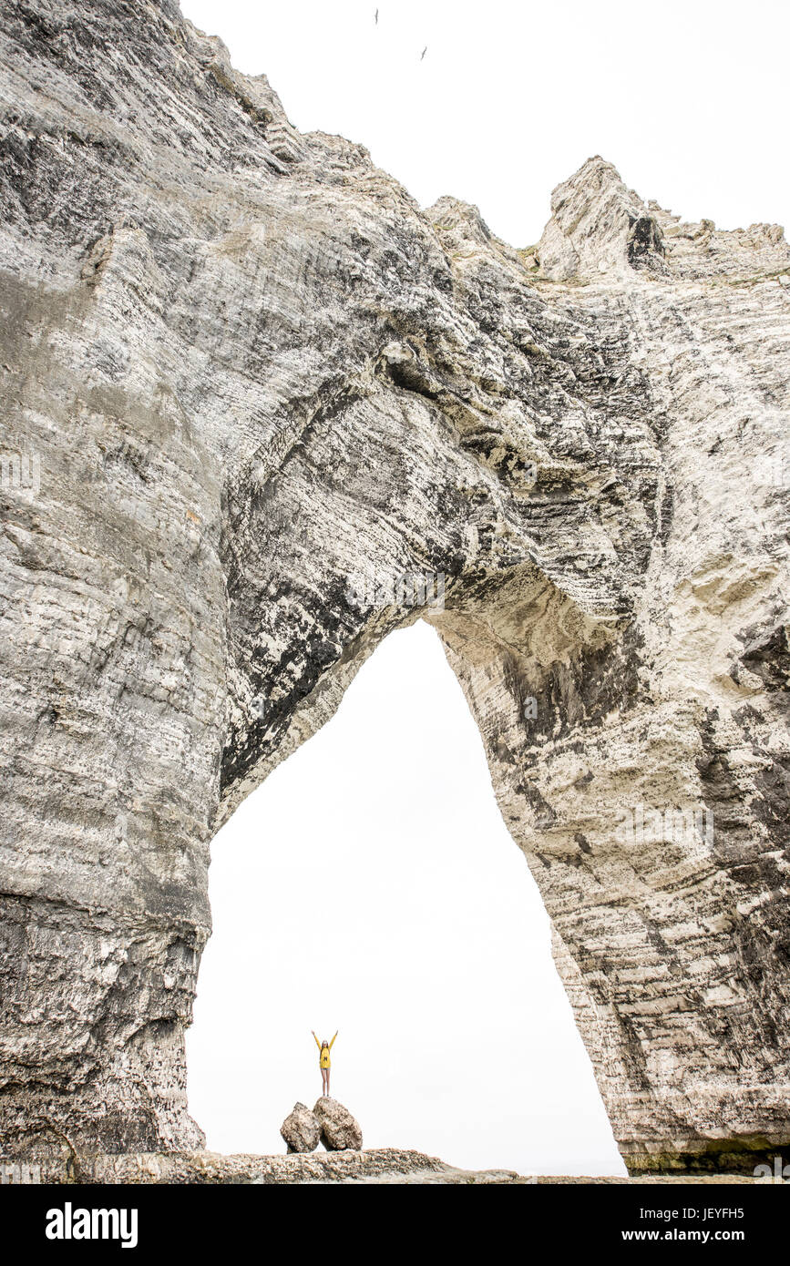 Landscape view on the huge stone cliff with a hole and traveler ...