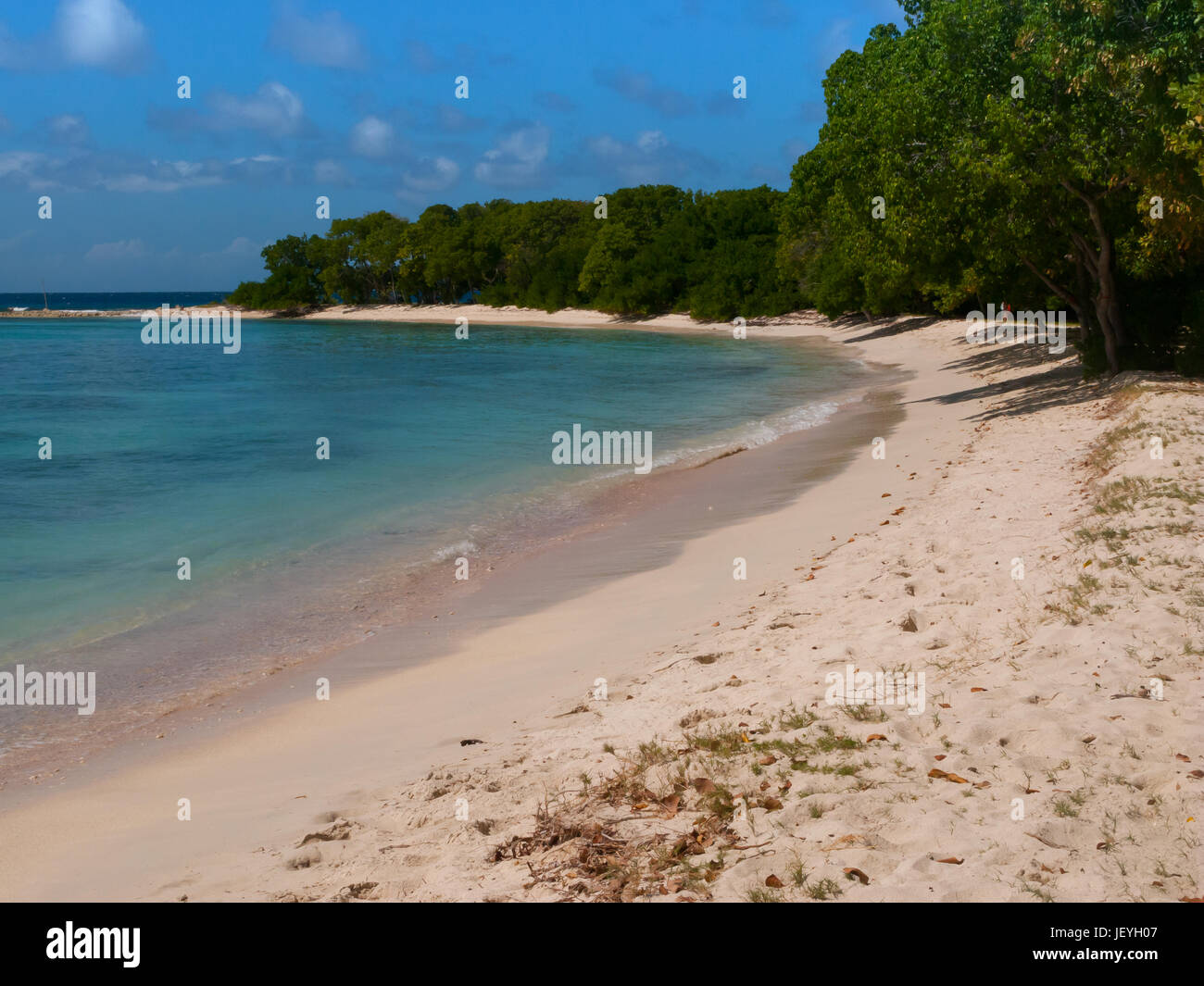 Lagoon Beach Mustique with its white sands and azure blue skies and ...