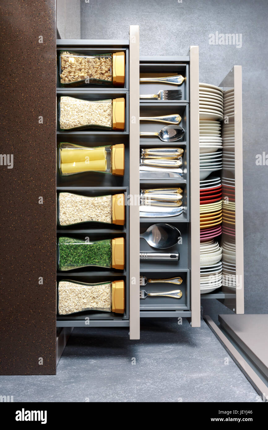 Modern kitchen countertop with food ingredients. Top view of drawers ...